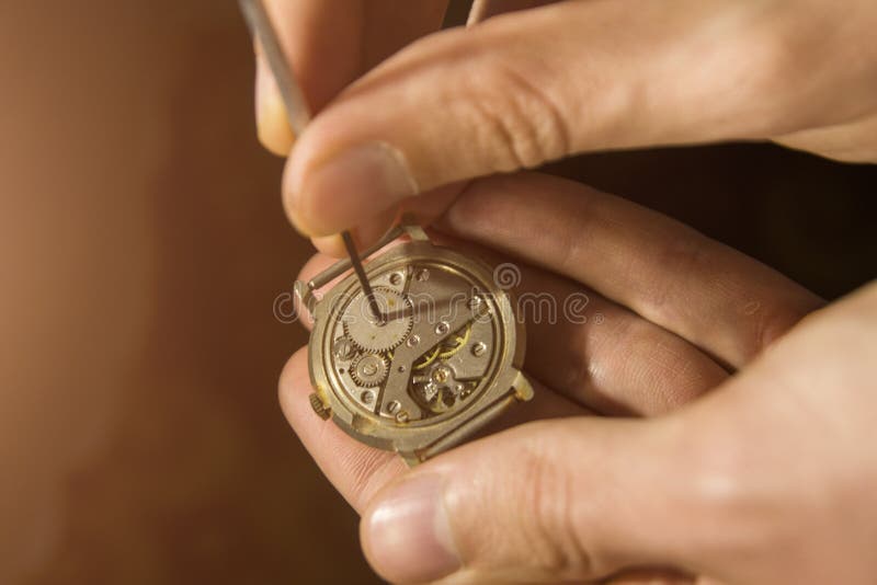 Watchmaker is Repairing the Mechanical Watches in His Workshop Stock ...