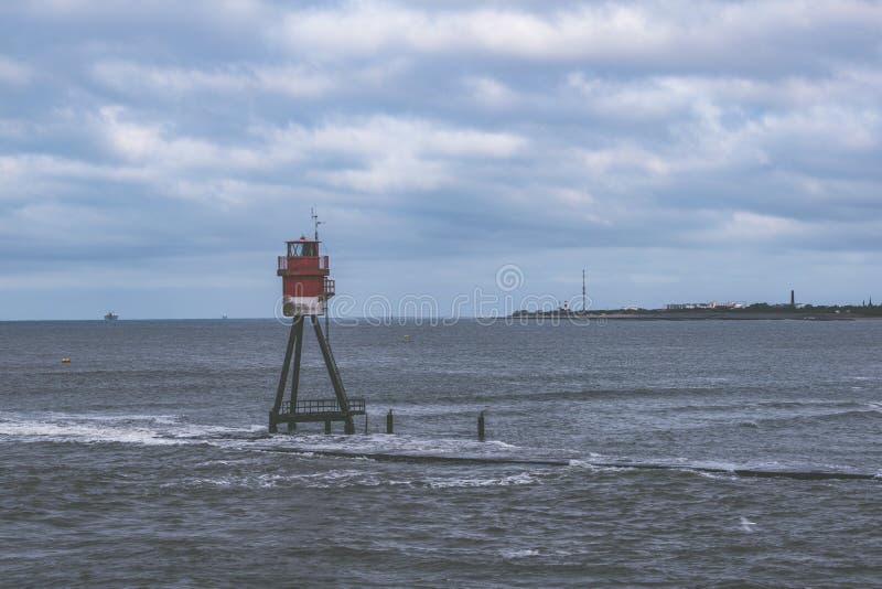 Watchtower by the Sea Under a Cloudy Sky in Borkum, Germany Stock Photo ...