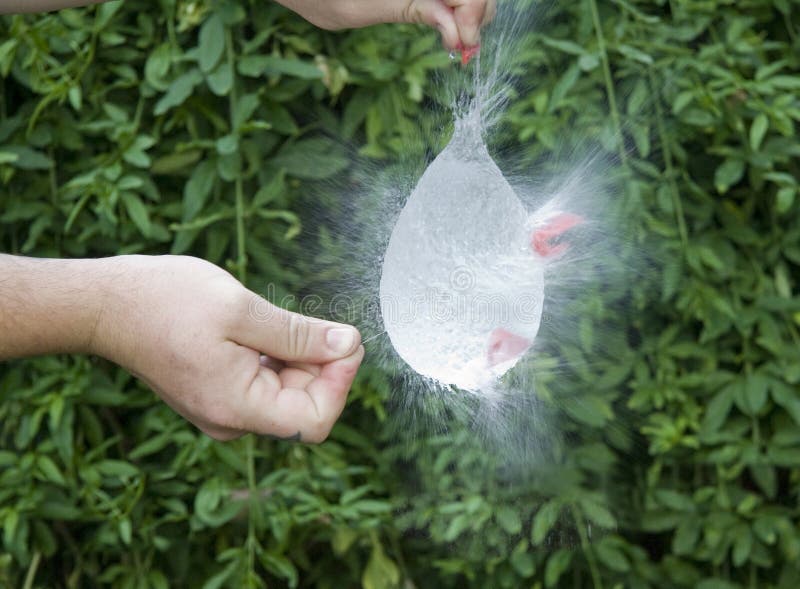 Water balloon explosion stock photo. Image of spray - 229714674