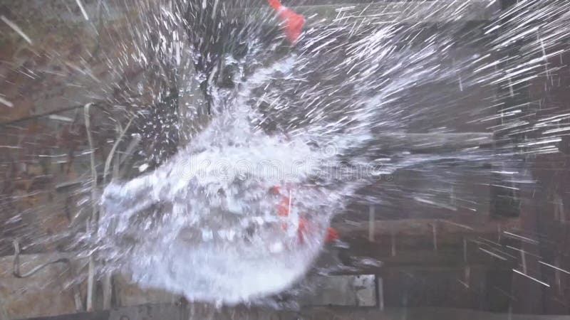Water Balloons Explode from Bullets Splashing Water Stock Video - Video ...