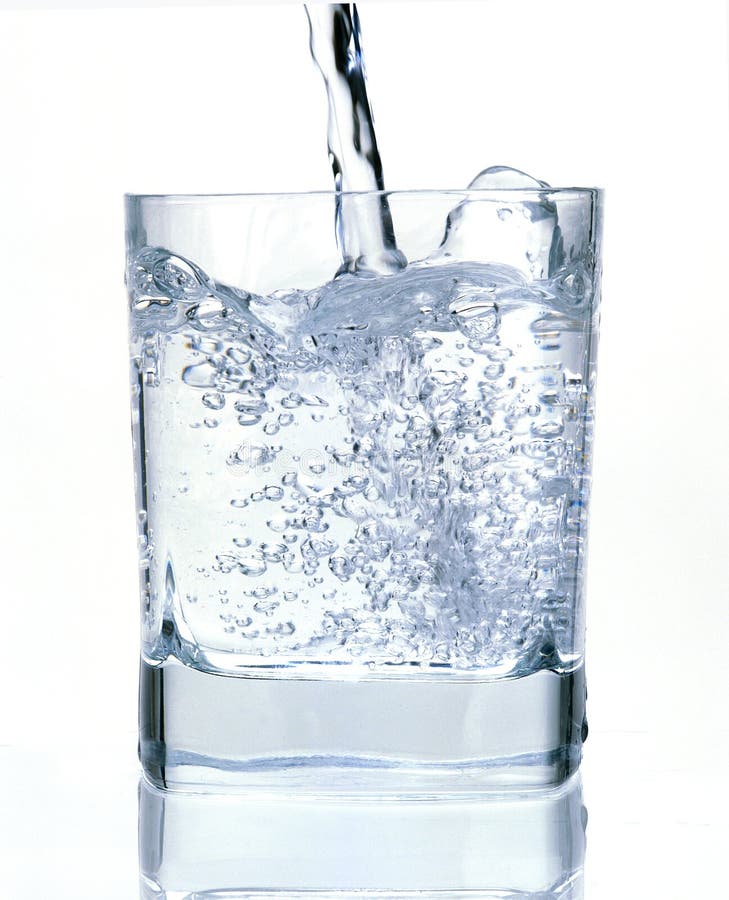 Water Being Poured in a Glass Against White Background Stock Photo ...
