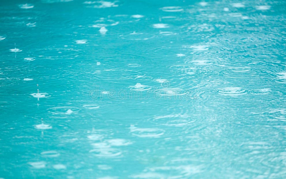 The Water is Blue and Has Raindrops on it Stock Image - Image of ...