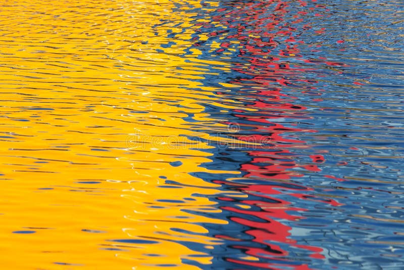 Water Blurred Background with Waves, Sunny Glares, Yellow, Blue and Red ...