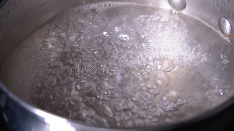 Process of Boiling Water, Close-up. Bubbles of Boiling Water in a Steel ...