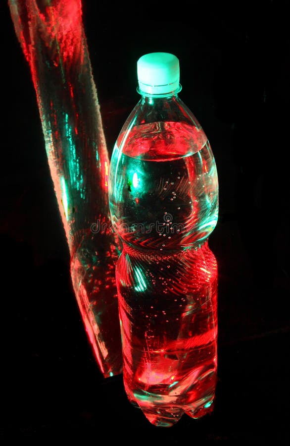 Water Bottle in Colored Lights Stock Image - Image of greenish, color ...