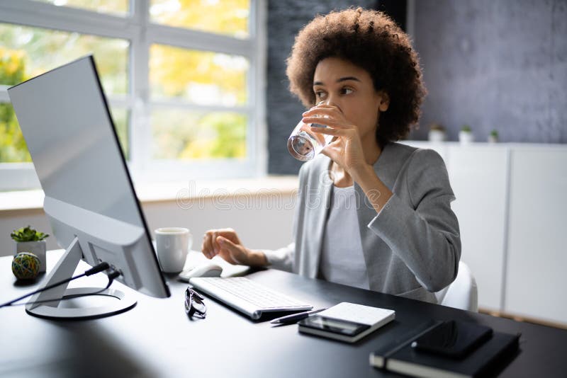 Water Bottle on Desk and Woman in Foreground Stock Image - Image of ...