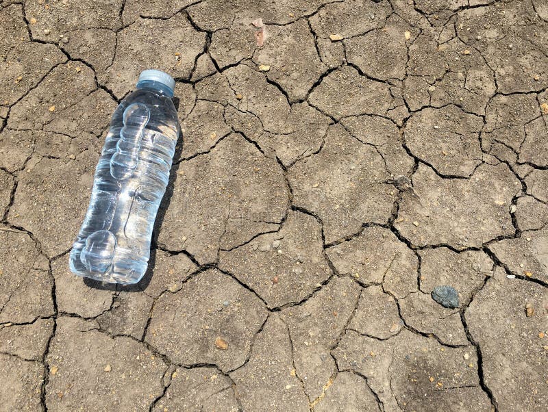 Water bottle on dry ground stock image. Image of environmental - 11228939