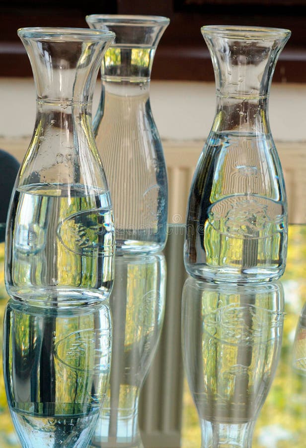 Water Bottles on Glass Table Stock Photo - Image of freshness ...