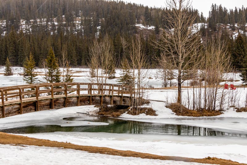 Water Breaking through the Ice at Cascade Ponds. Banff National Park ...