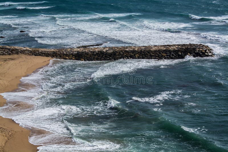Water breaking on sand stock photo. Image of waves, powerful - 93353924