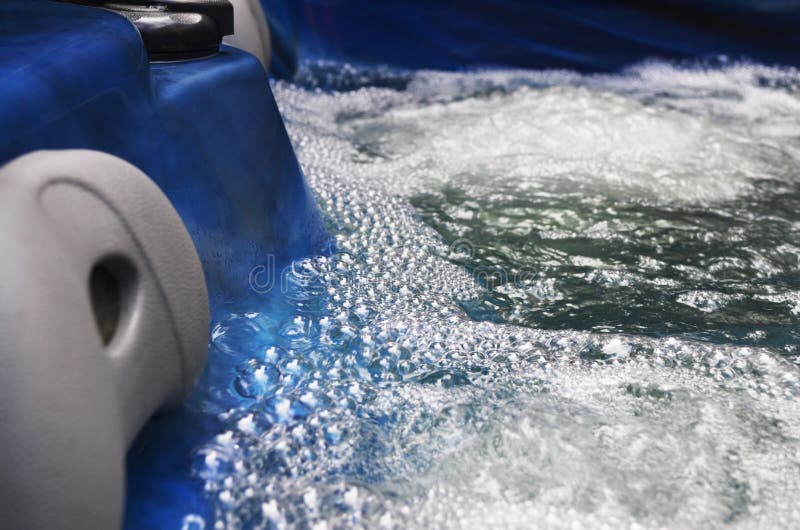Air Bubbles From Jacuzzi Jet In Bubbly Blue Water In A Thermal Spa Pool ...