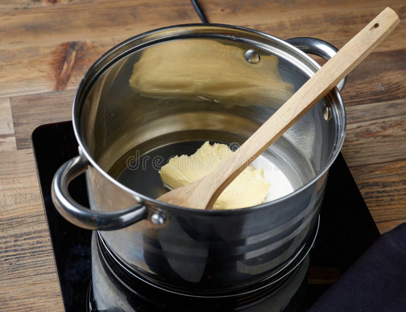 Water and butter in a pot stock photo. Image of household - 221675854