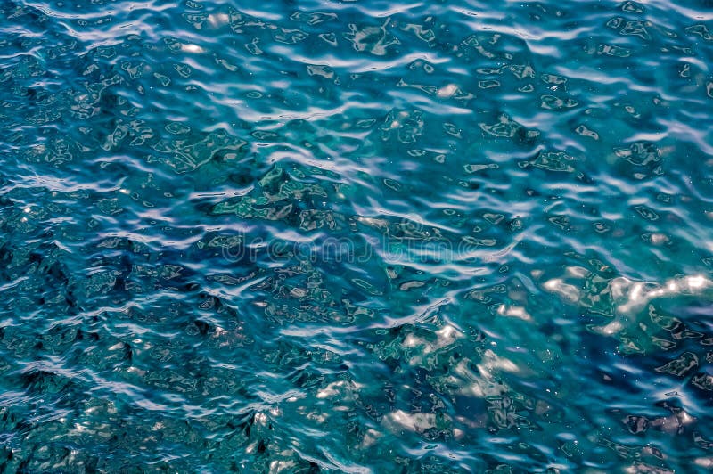 The Water is Calm and Clear, with Ripples Forming on the Surface Stock ...