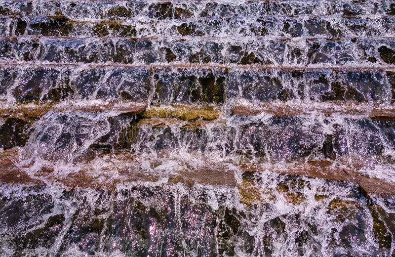 Water Cascading Down a the Steps of a Water Feature Stock Image - Image ...