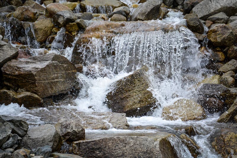 Water Cascading over Rocks stock photo. Image of stone - 191581752