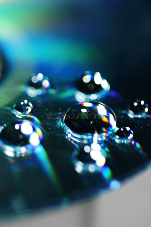 Water Drops on CD Wallpaper Stock Image - Image of macro, light: 25300649