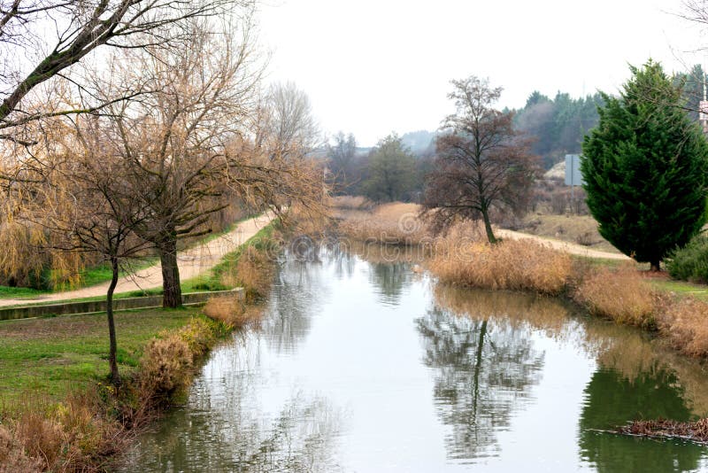 Water Channel with Path To the Sides and Fog Stock Photo - Image of ...