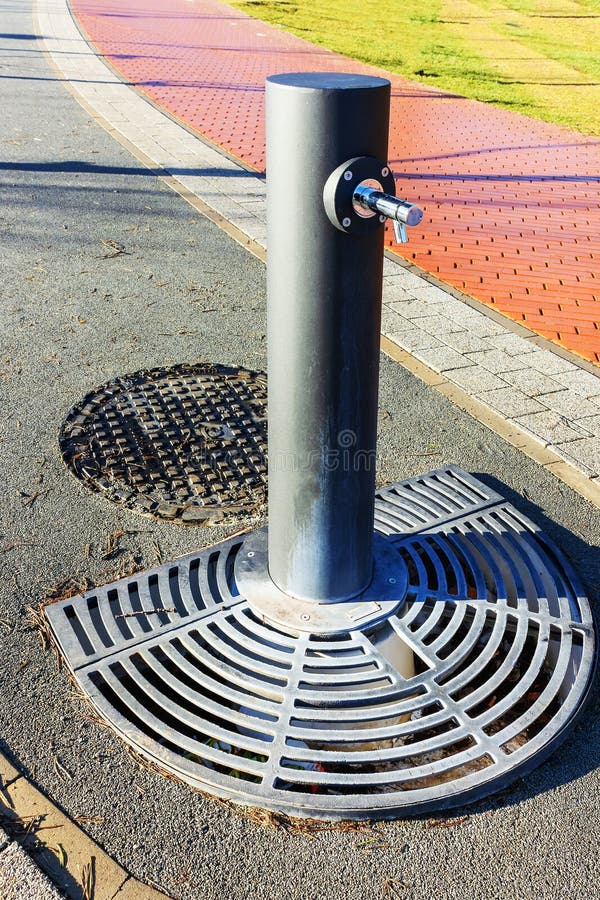 A Water Column in a City Park during the Day Stock Photo - Image of ...