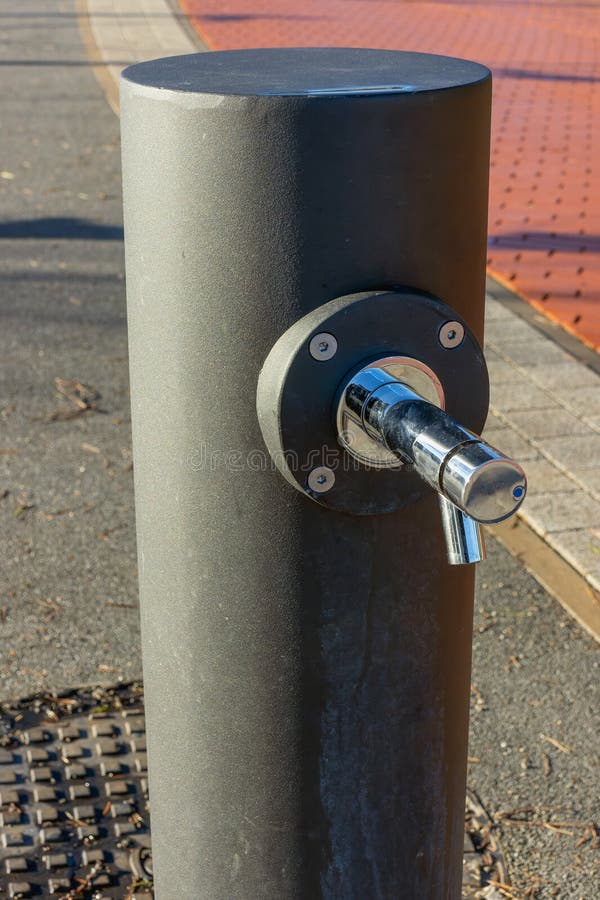 A Water Column in a City Park during the Day Stock Photo - Image of ...