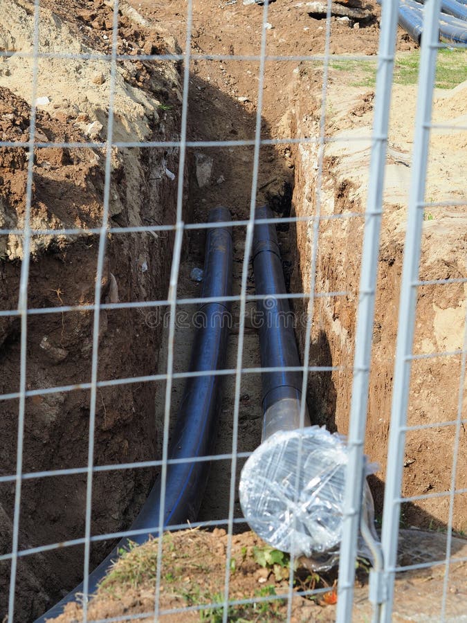 Repair Work on Laying Pipes in the Ground. Stock Image - Image of ...