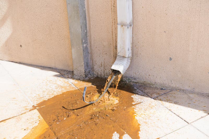Water Contaminated with Rust and Sand Flowing from a Building S ...