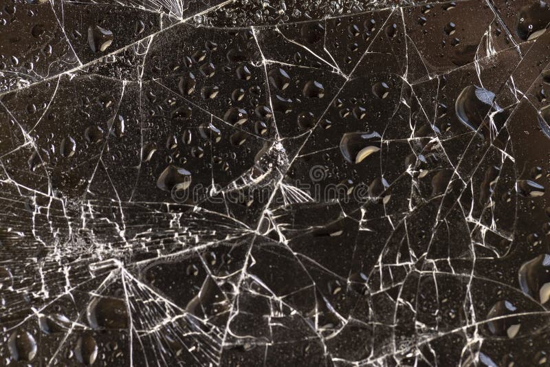 Water Covered Broken Glass on a Dark Background, Wet Thin Glass Stock ...