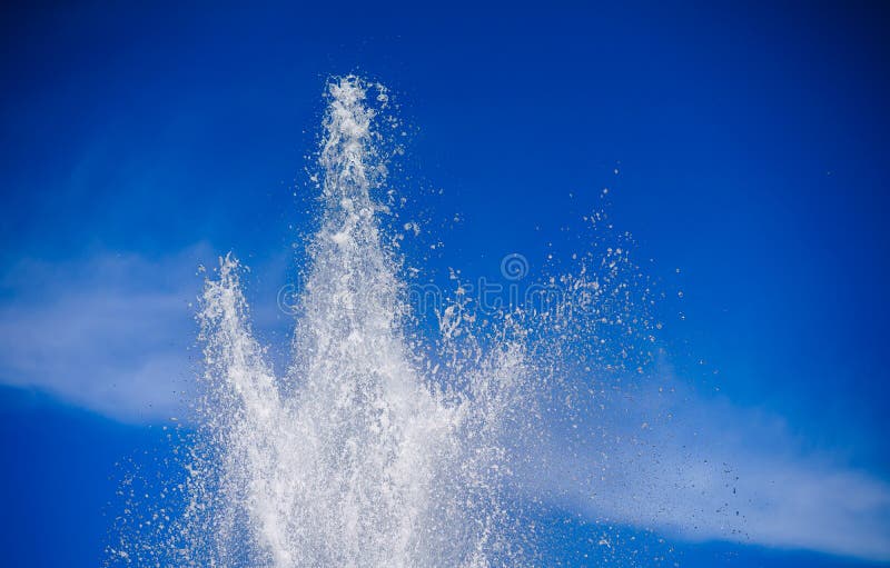 Water and Dance of Drops on a Background of Blue Sky. Stock Image ...