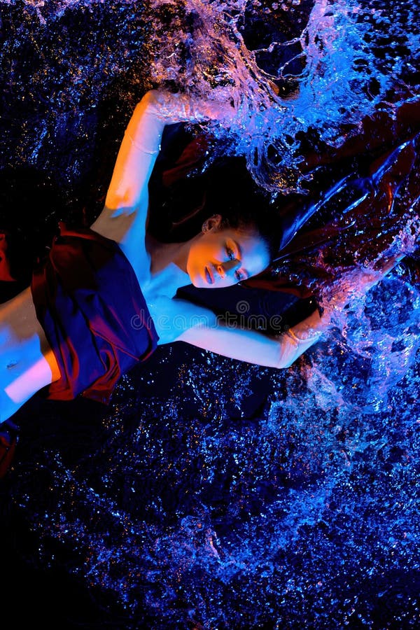 Water Dance Performance at Night with Vibrant Lighting and Flowing ...