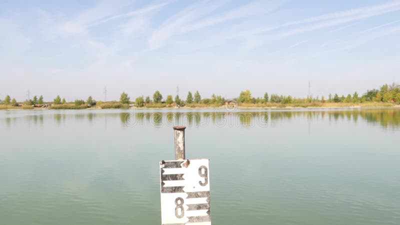 Water Depth Measuring Stick in a Lake Stock Video - Video of water ...