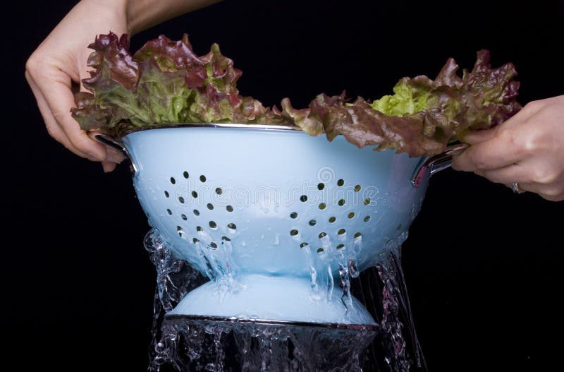 Water Draining from a Blue Colander. Stock Photo - Image of hands ...