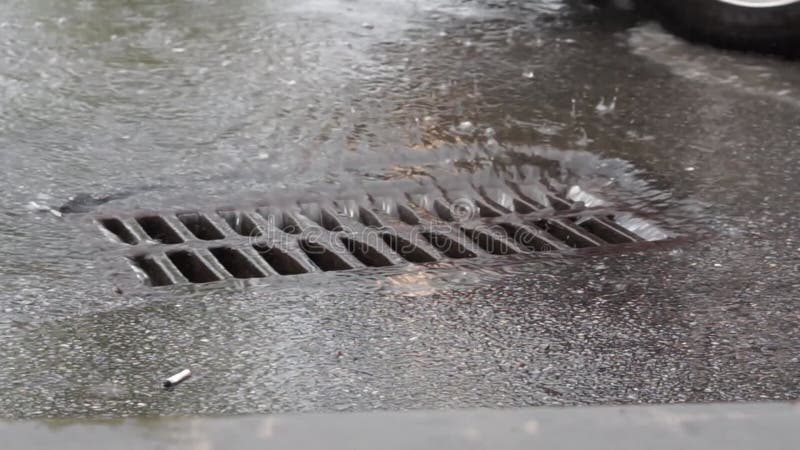 Water Drains into the Sewer through the Iron Grid Stock Footage - Video ...