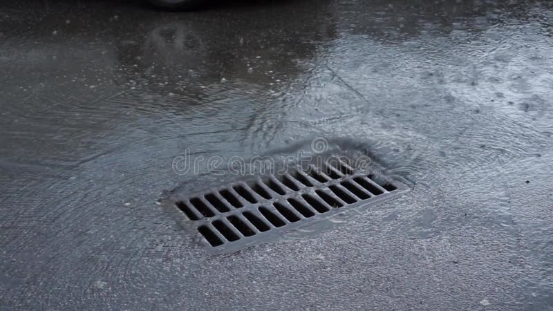 Water Drains into the Sewer through the Iron Grid Stock Footage - Video ...
