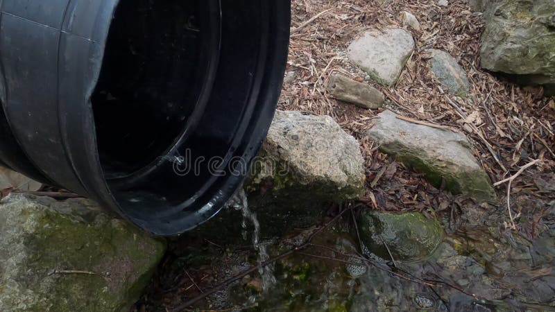 Water Dripping from Black Drain Pipe. Stock Footage - Video of rocks ...