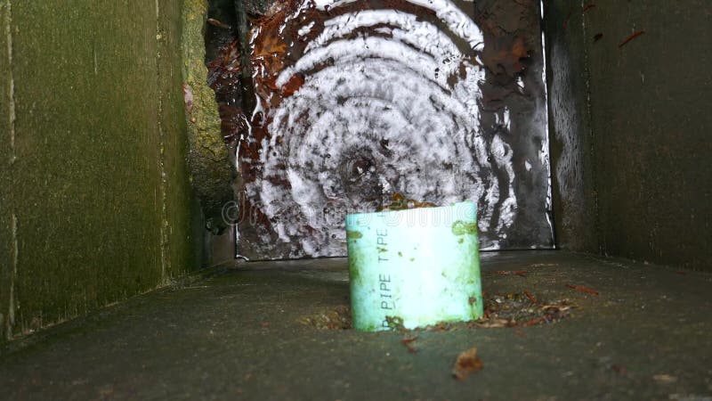 Water Dripping from Drain Pipe into Sewer with Water Sounds Stock Video ...