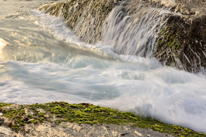 Water Dripping between Rocks Stock Photo - Image of coastline, foam ...