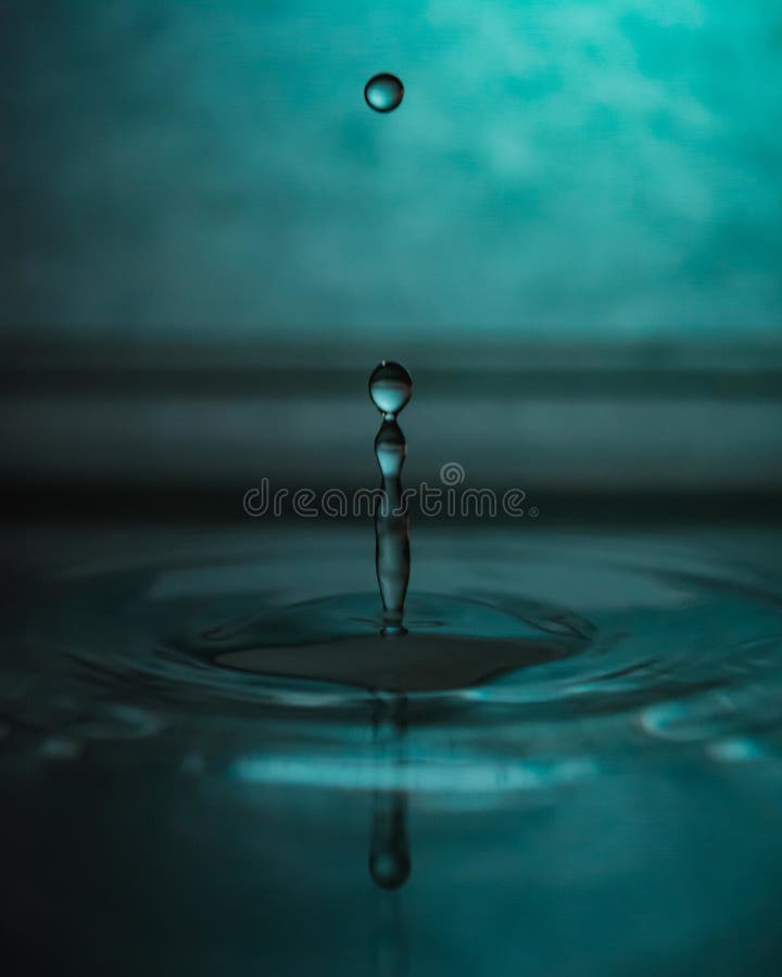 Water Dripping and Splashing with a Blue Effect Stock Photo - Image of ...
