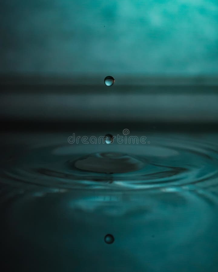 Water Dripping and Splashing with a Blue Effect Stock Image - Image of ...