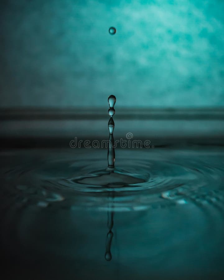 Water Dripping and Splashing with a Blue Effect Stock Photo - Image of ...