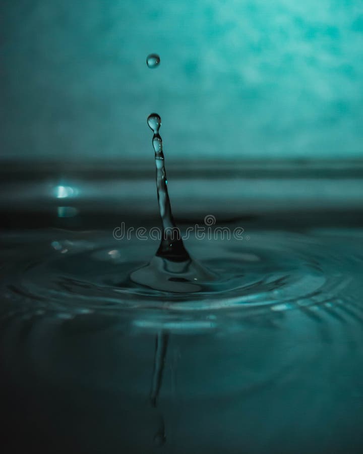 Water Dripping and Splashing with a Blue Effect Stock Image - Image of ...
