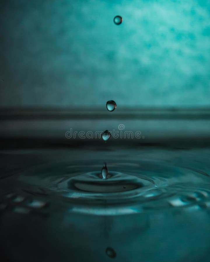 Water Dripping and Splashing with a Blue Effect Stock Photo - Image of ...