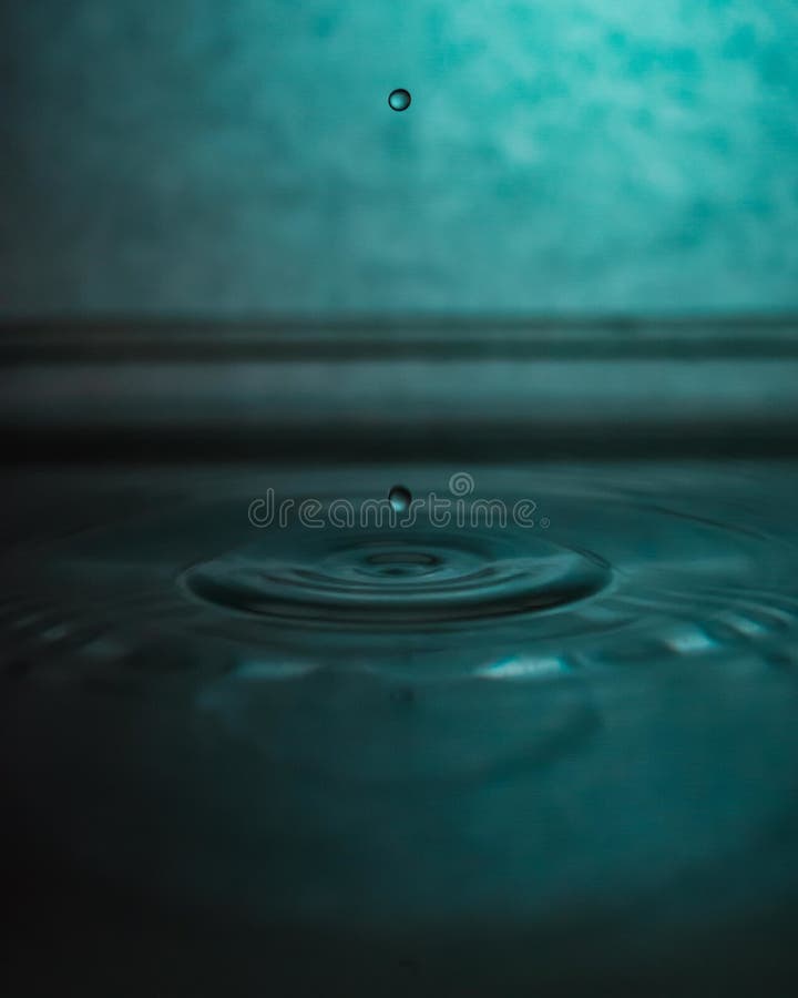 Water Dripping and Splashing with a Blue Effect Stock Image - Image of ...