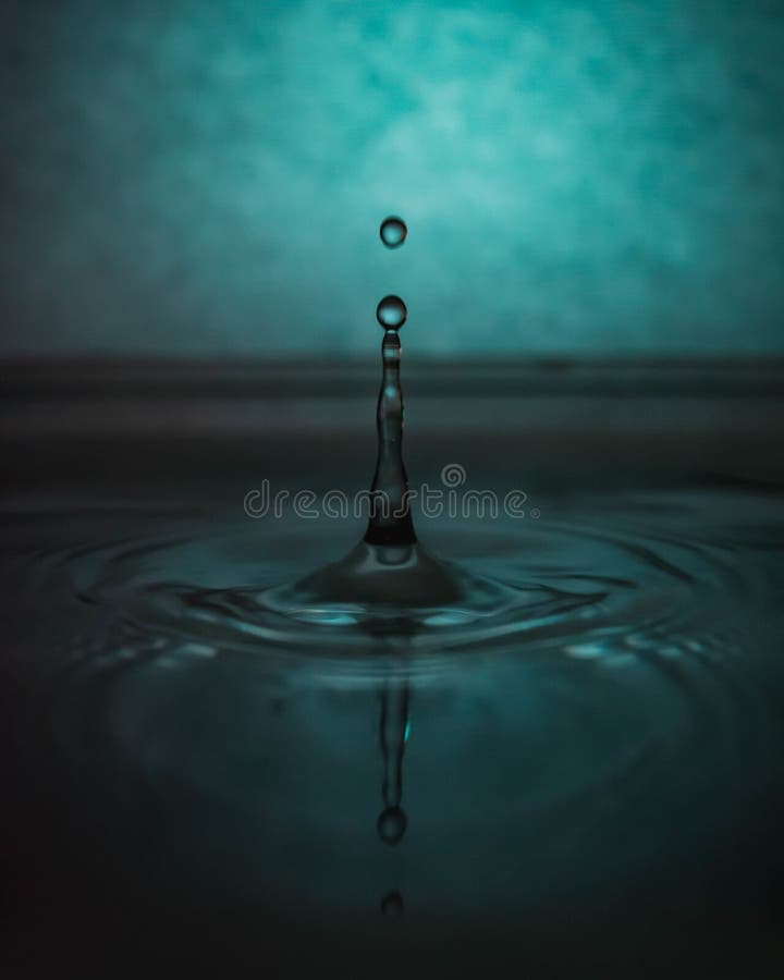 Water Dripping and Splashing with a Blue Effect Stock Photo - Image of ...