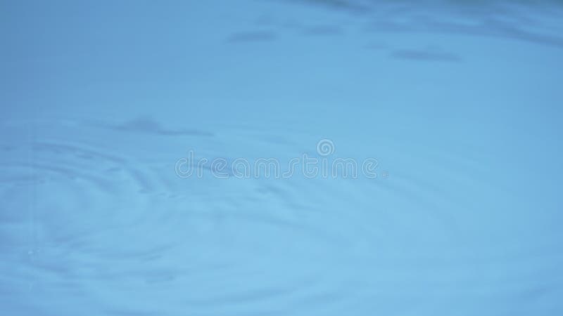 Water Dripping and Splashing in a Clear Blue Environment Stock Footage ...
