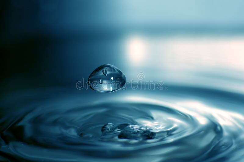Water Dropping into a Pool stock image. Image of drop, ripples - 1607