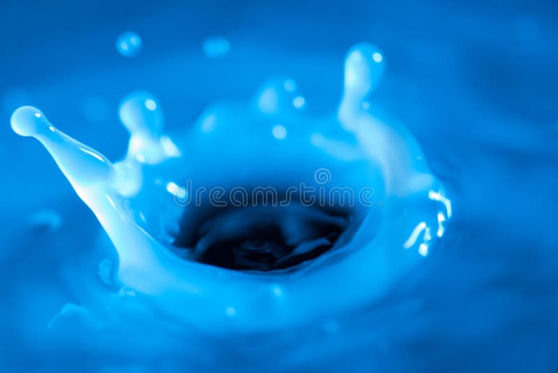 Water drop in blue light stock image. Image of flowing - 41472985