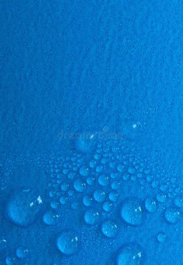 Water drop on blue paper stock image. Image of nature - 23059035