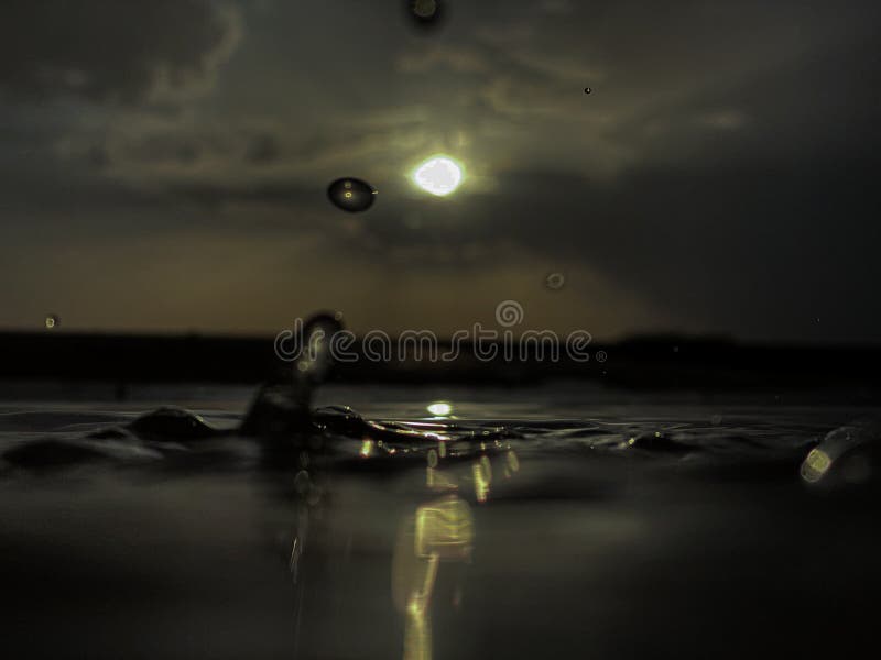 Water Drop Bounce Back from Puddle of Rain Water Stock Image - Image of ...