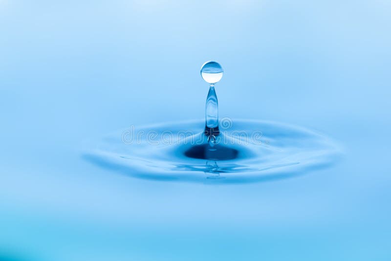 Water Drop on Clear Water Surface. Idea for Pure Drinking Water. Saving ...