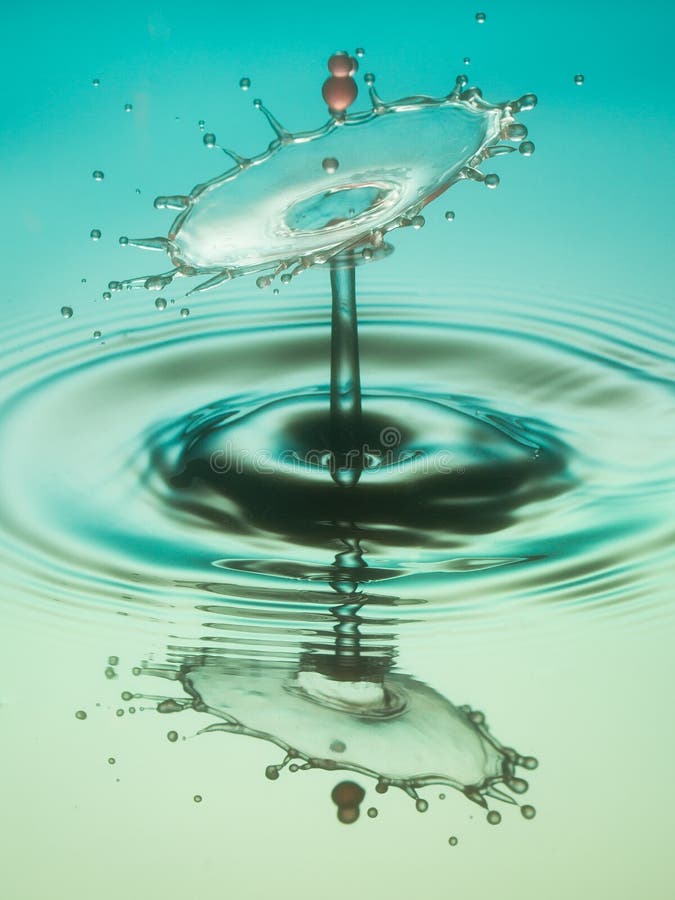 Water Drop Collision stock photo. Image of yellow, water - 30710648