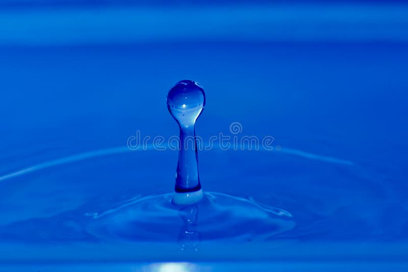 Water Drop Creates a Column upon Impact Stock Image - Image of ...